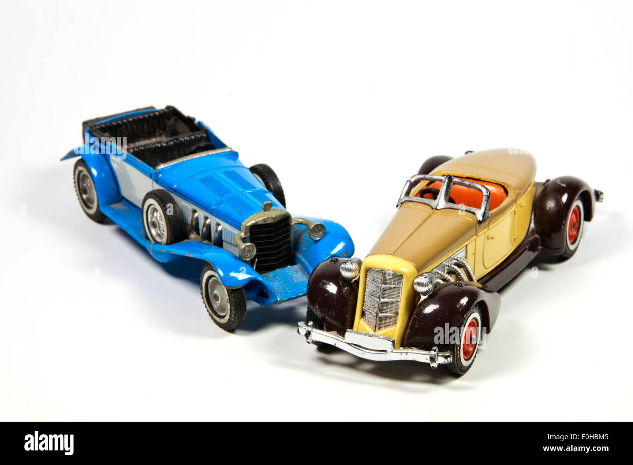 two vintage toy model cars on white Stock Photo - Alamy