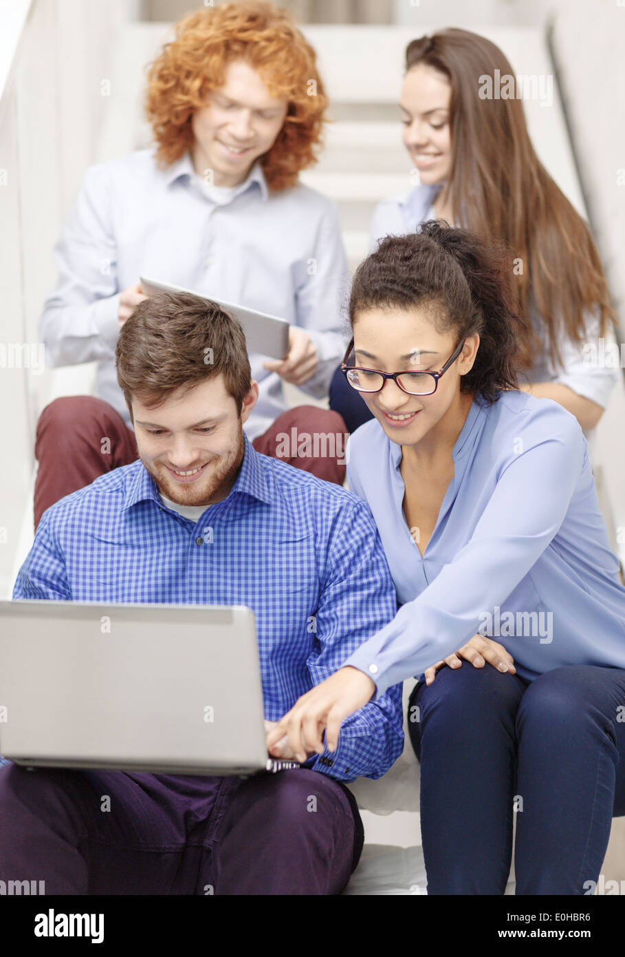 Business team pointing laptop tablet hi-res stock photography and ...