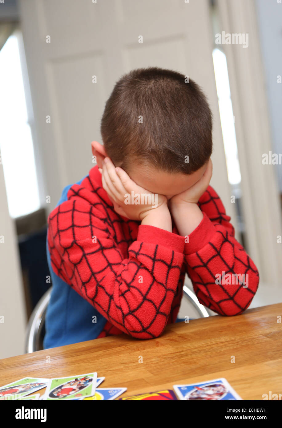 4 year old boy sulking Stock Photo - Alamy