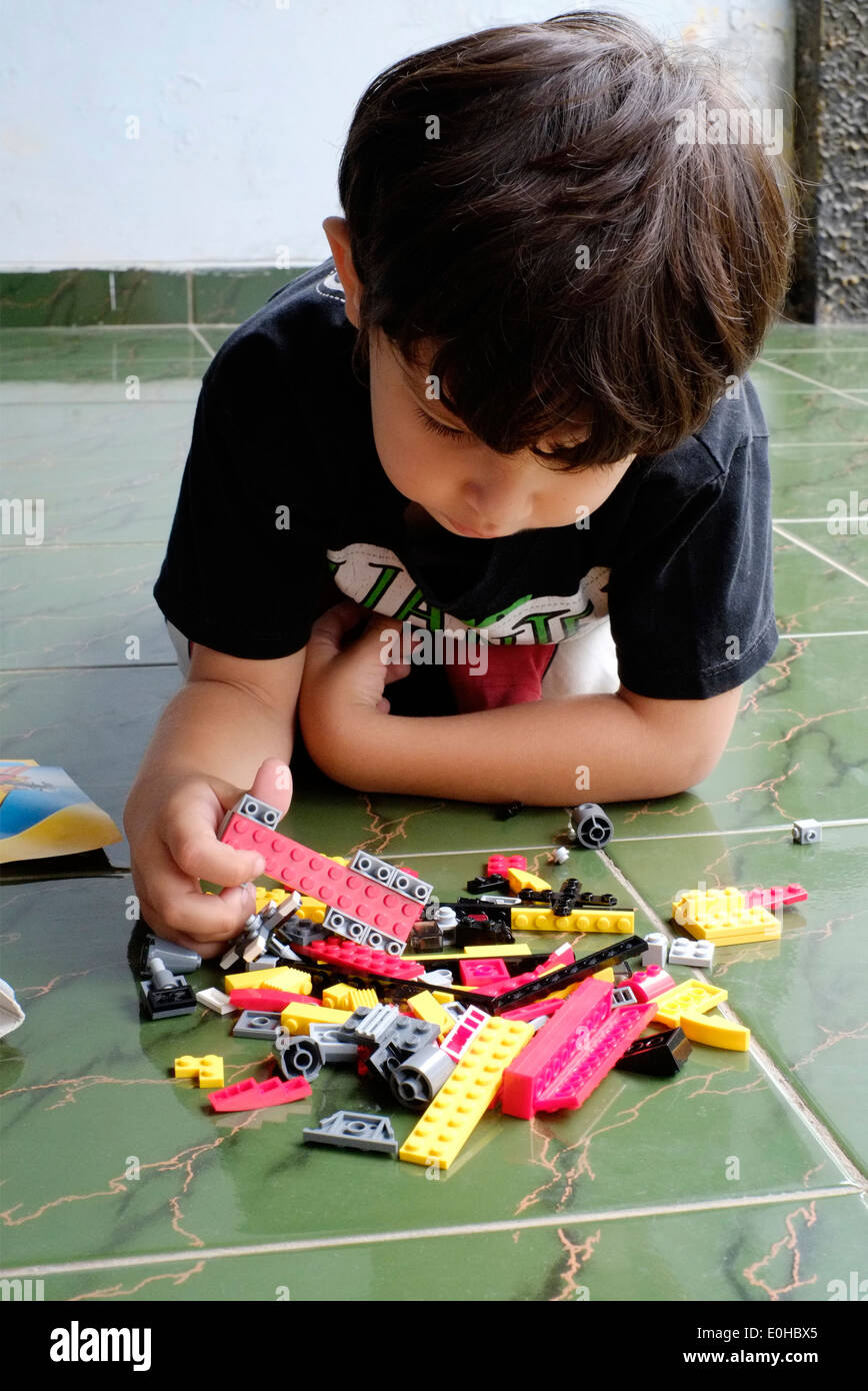 little boy playing with lego Stock Photo - Alamy