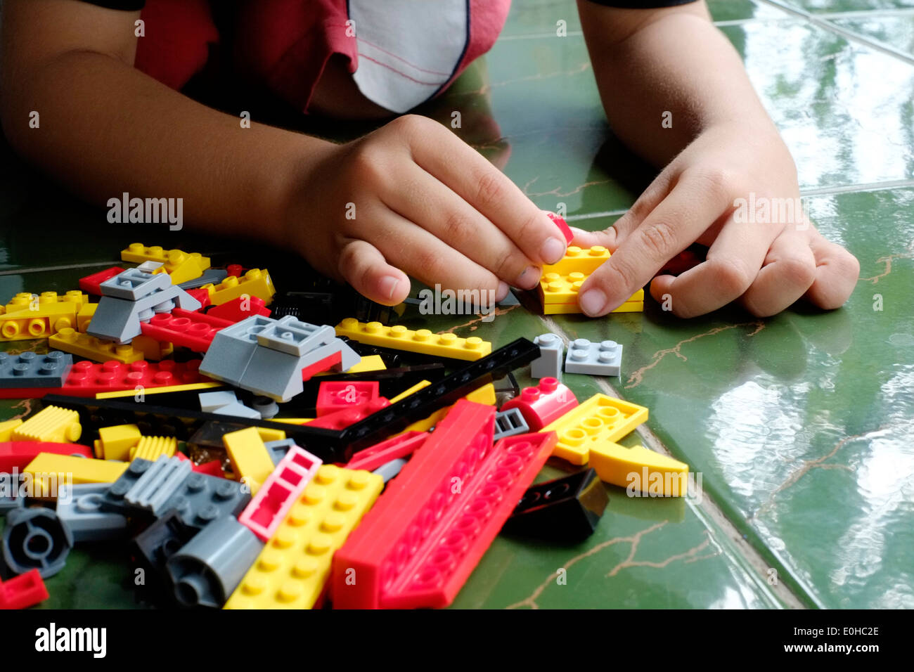 little boy playing with lego Stock Photo - Alamy