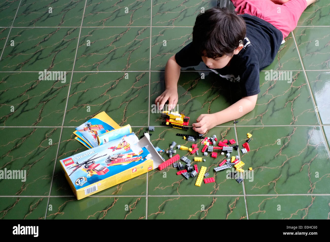 little boy playing with lego Stock Photo - Alamy