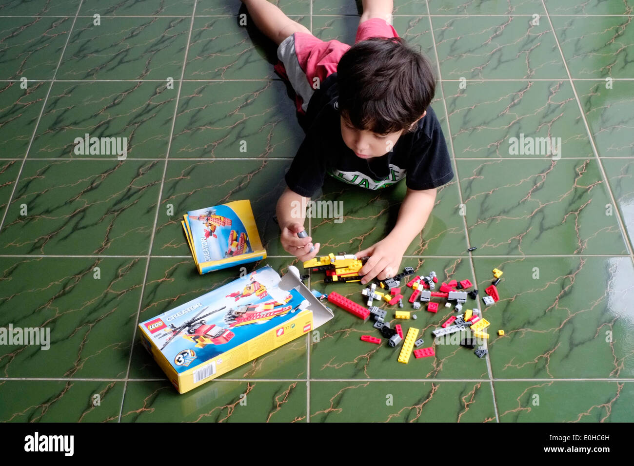 little boy playing with lego Stock Photo - Alamy