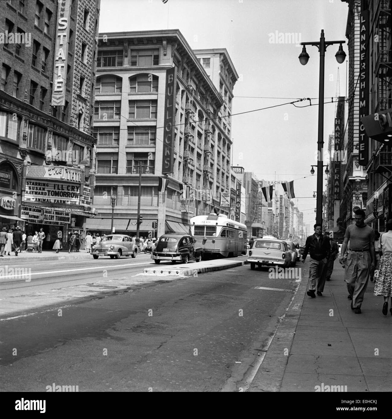 This photograph from 1956 shows a street scene in Los Angeles ...