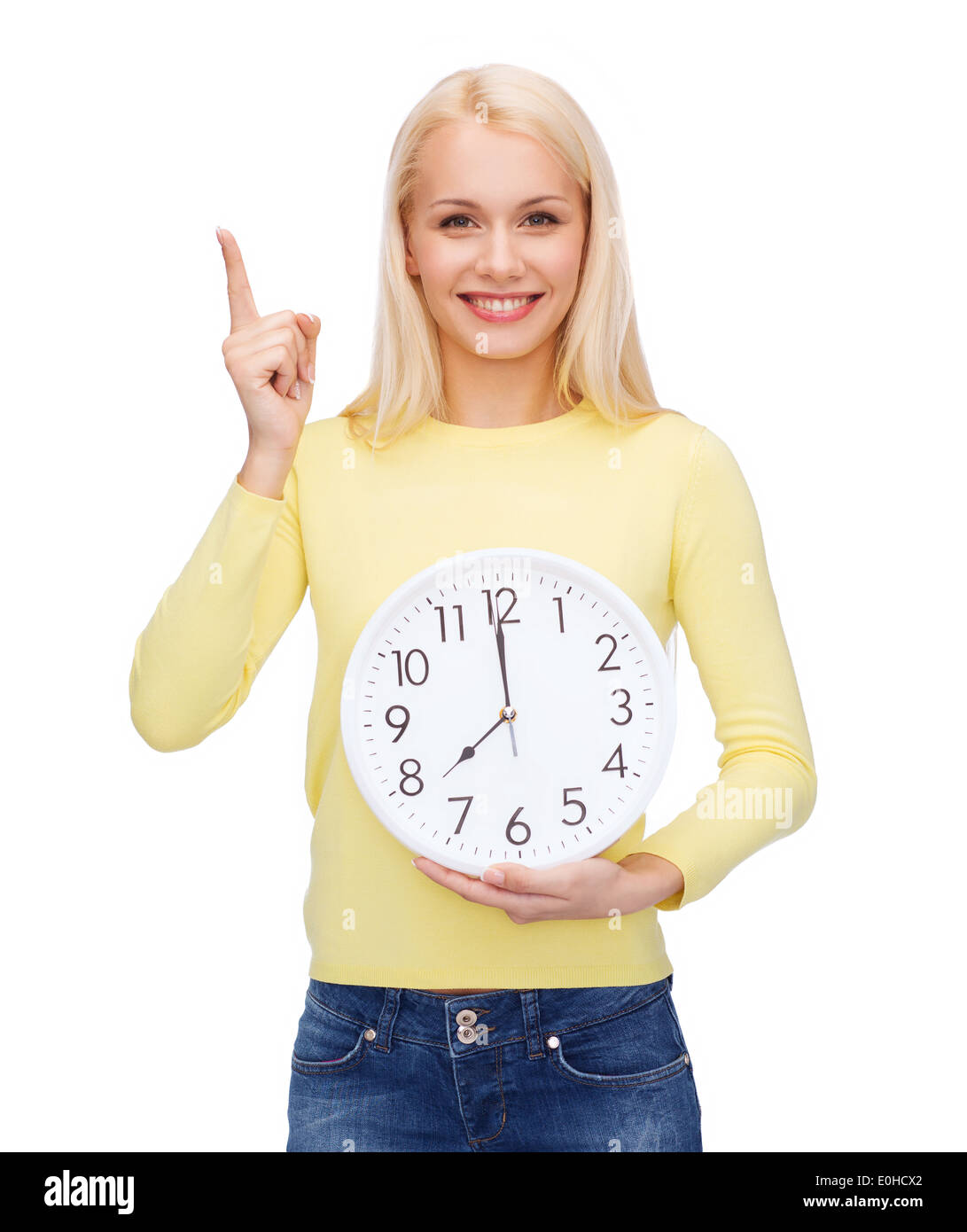 student with wall clock and finger up Stock Photo - Alamy