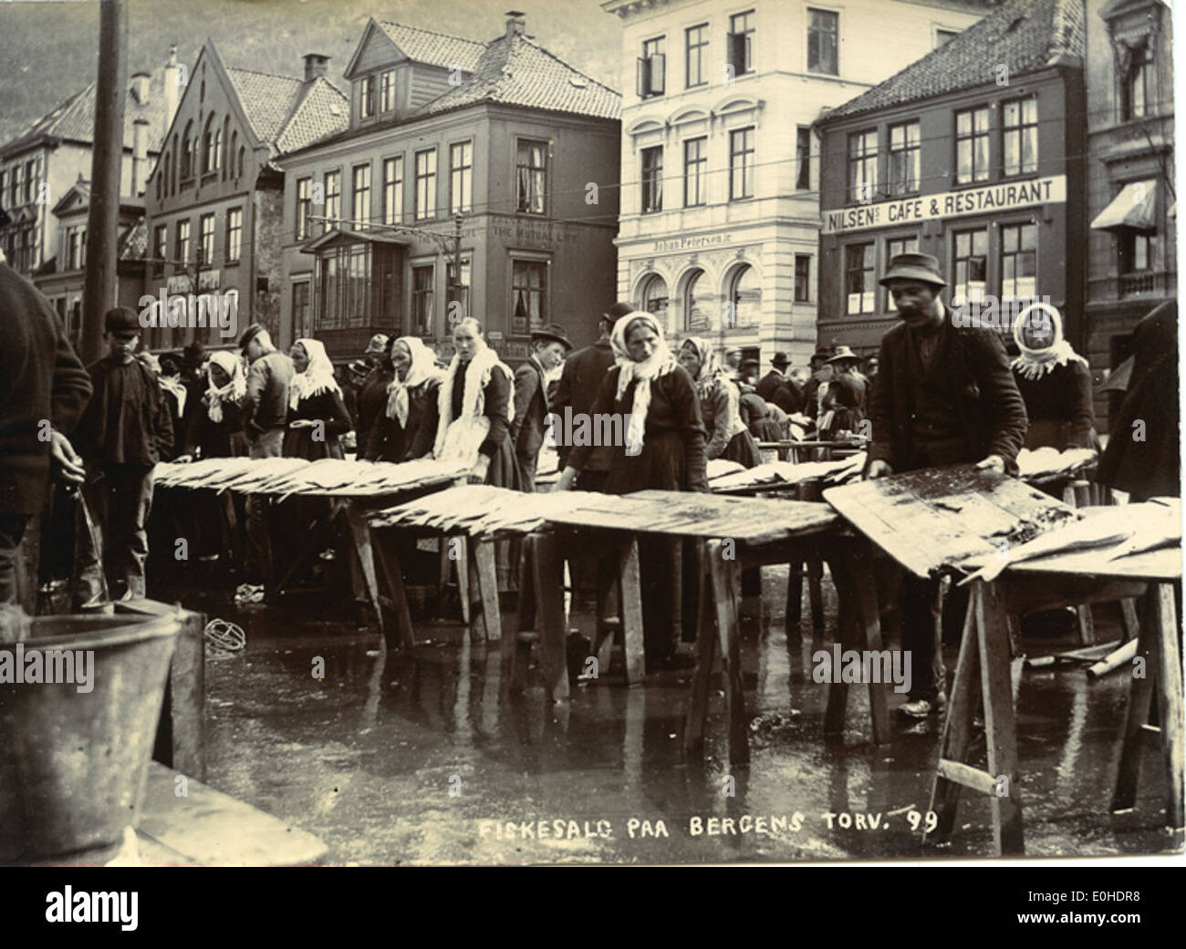 This image shows a market scene at the Fish Market (Fisketorget) in ...