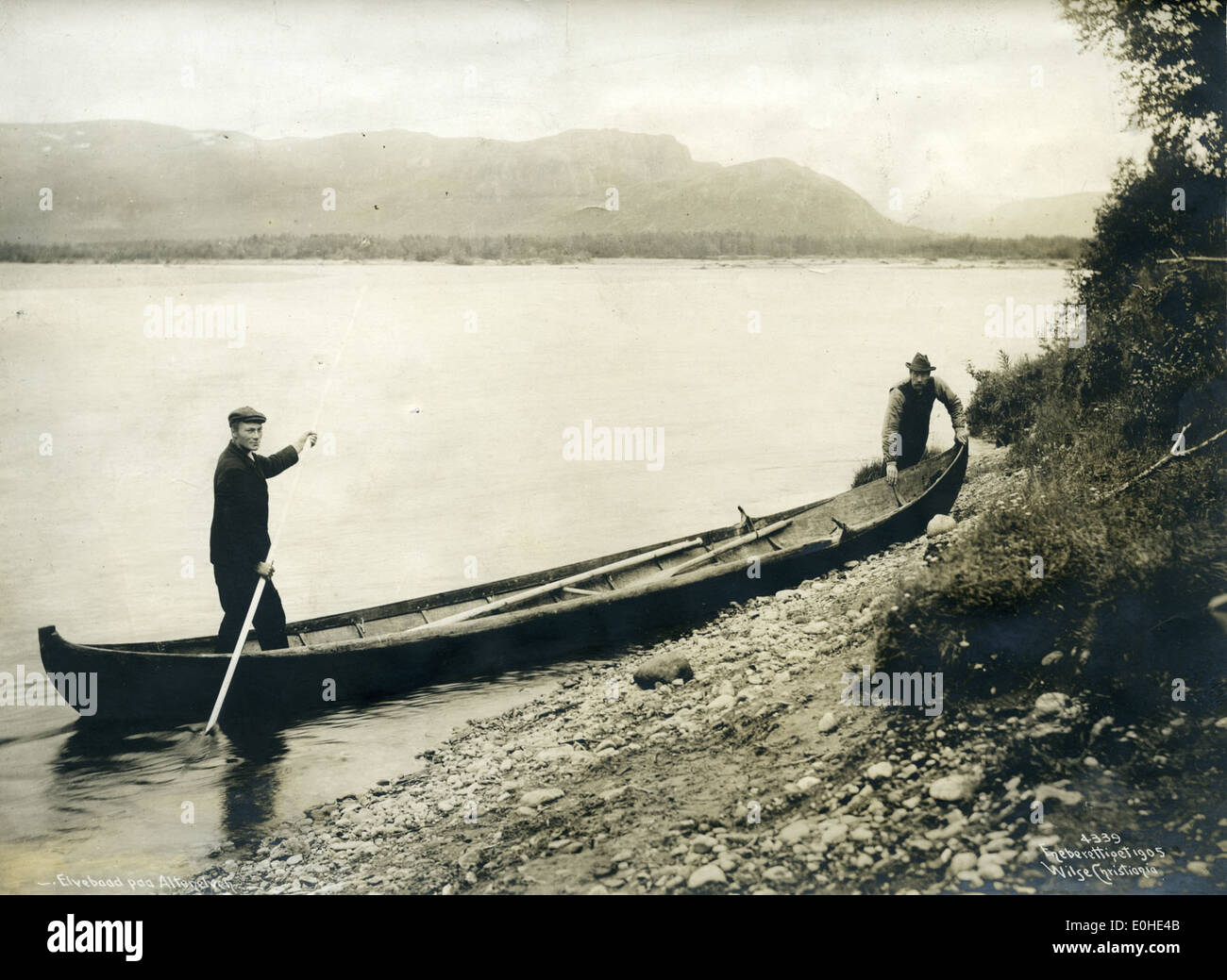 A photograph of a boat on the Altaelva River in Norway, showcasing the ...
