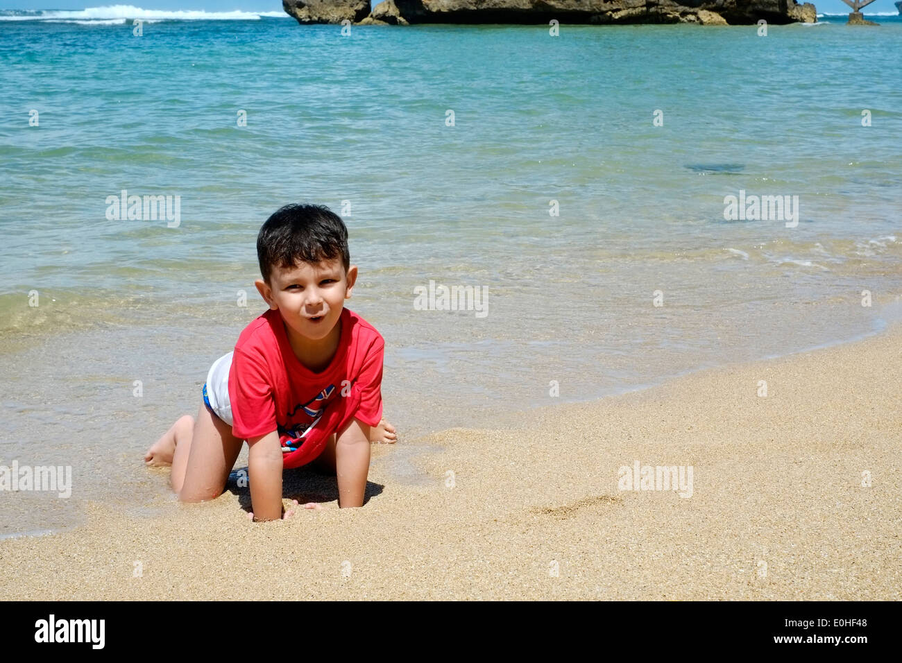 young local boy on the beach by the sea at balekambang east java ...