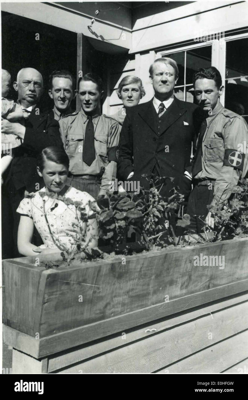 This image shows Vidkun Quisling with party members during World War II ...