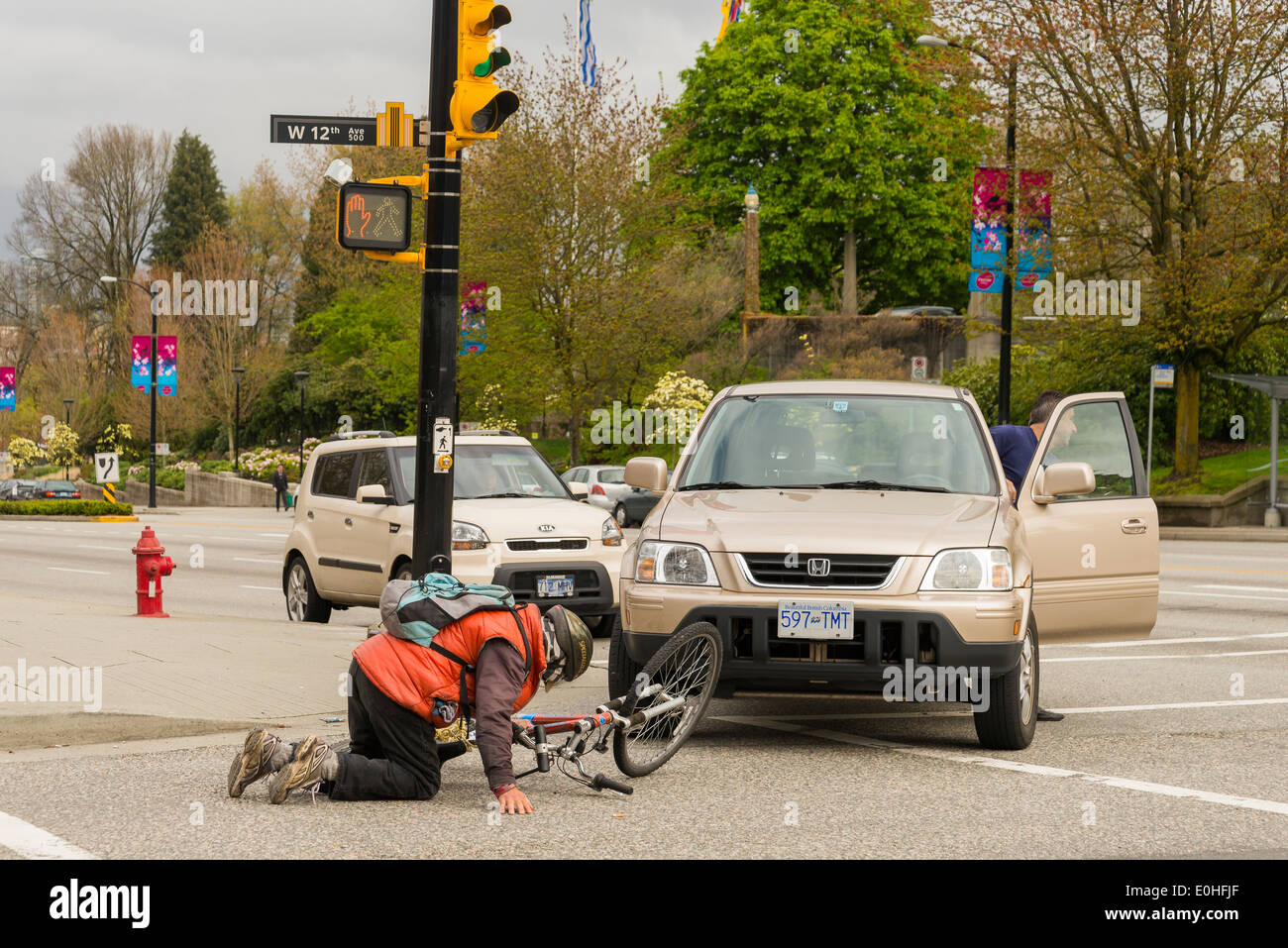 Aftermath of accident in intersection involving a cyclist. Cyclists ...