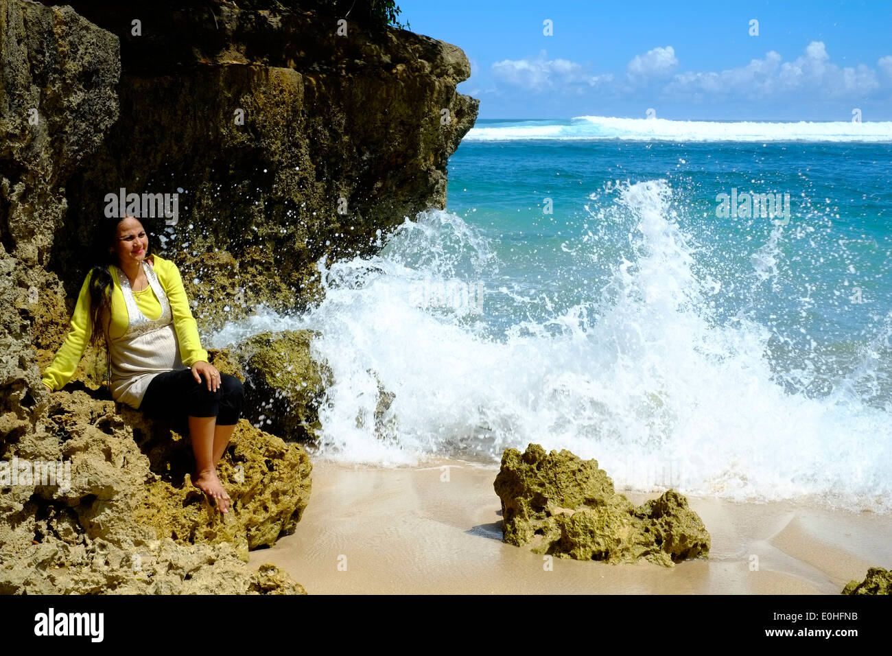 local woman enjoying the beach and sea at balekambang east java ...