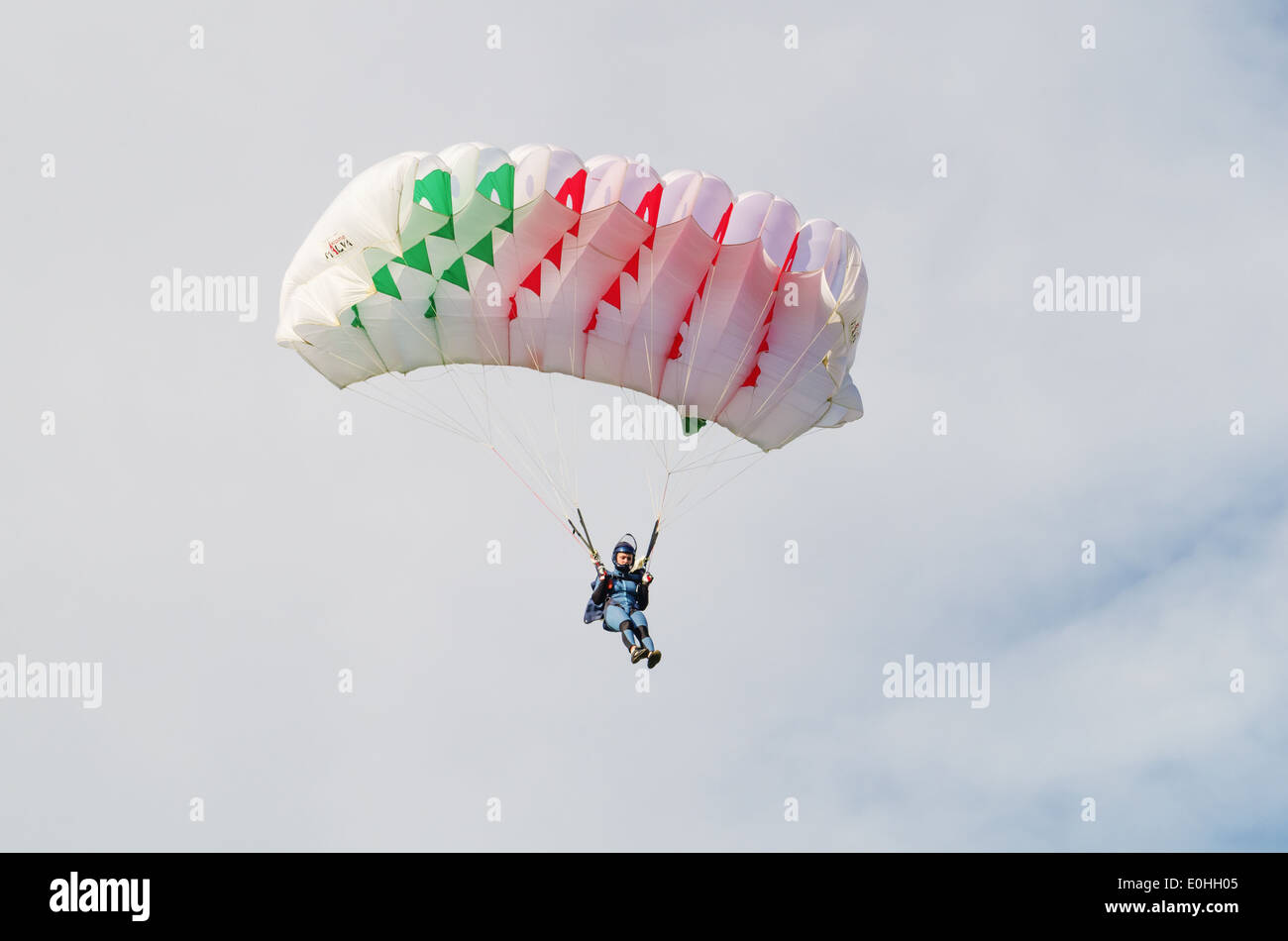 One day with parachutist in airfield. The girl skydiver landing under ...