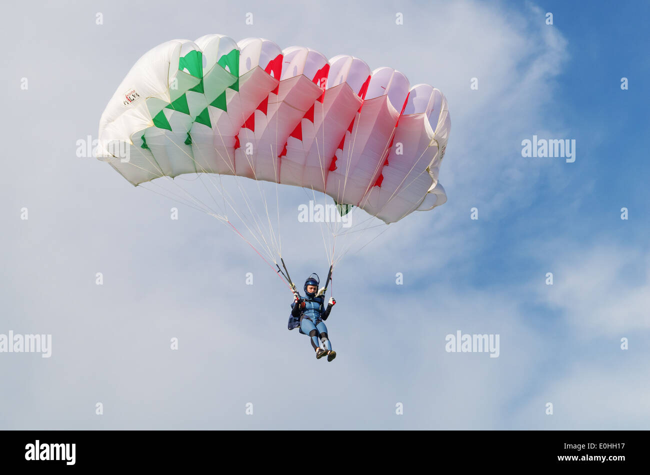 One day with parachutist in airfield. The girl skydiver landing under ...