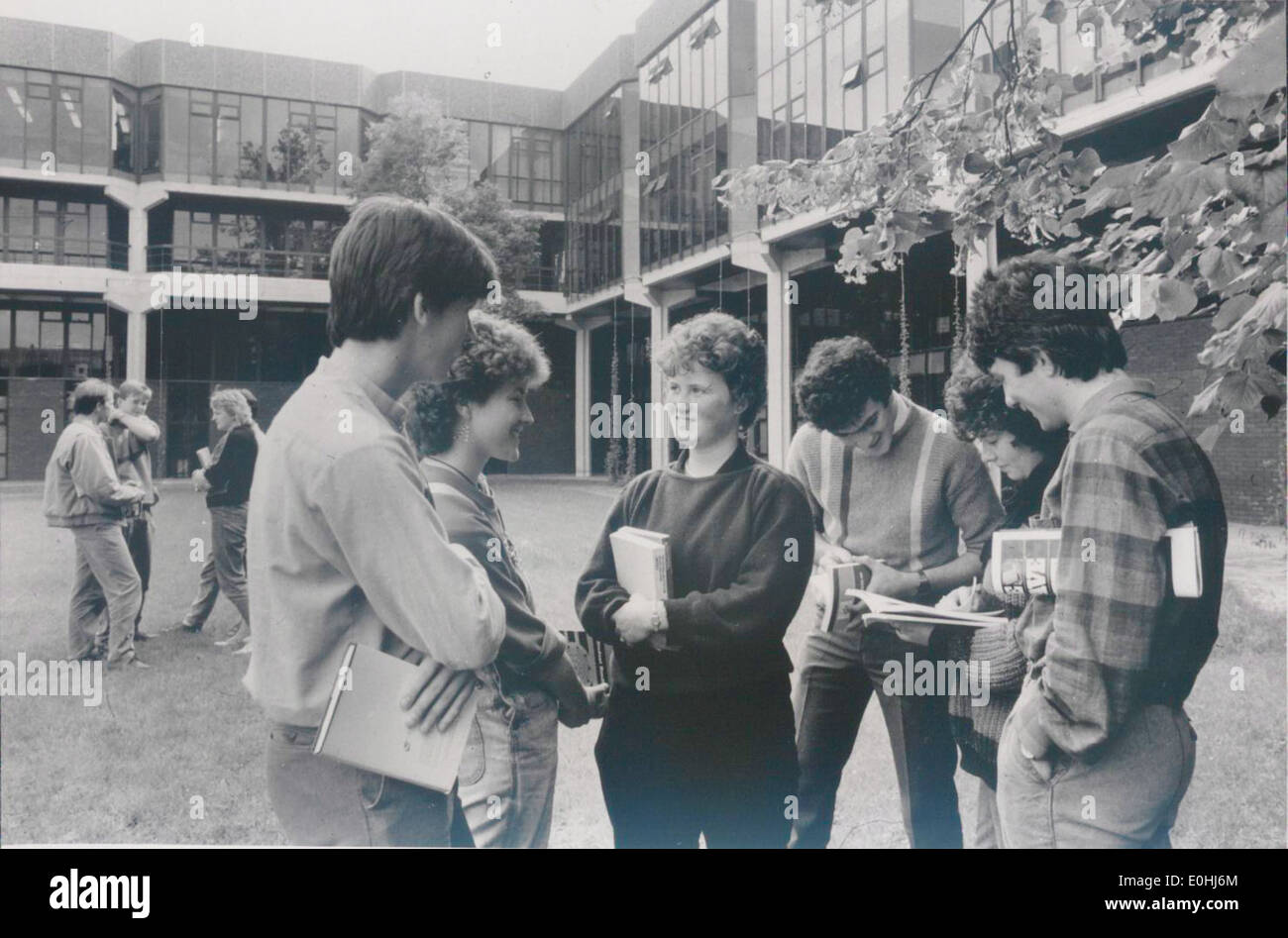 A photograph of students on the quad beside the main building at the ...