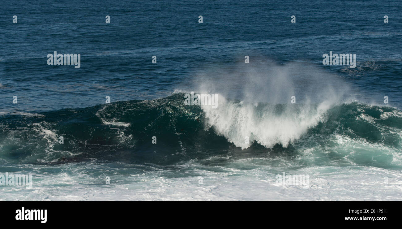 Wave breaking on the beach, Cape Spear, St. John's, Newfoundland And ...