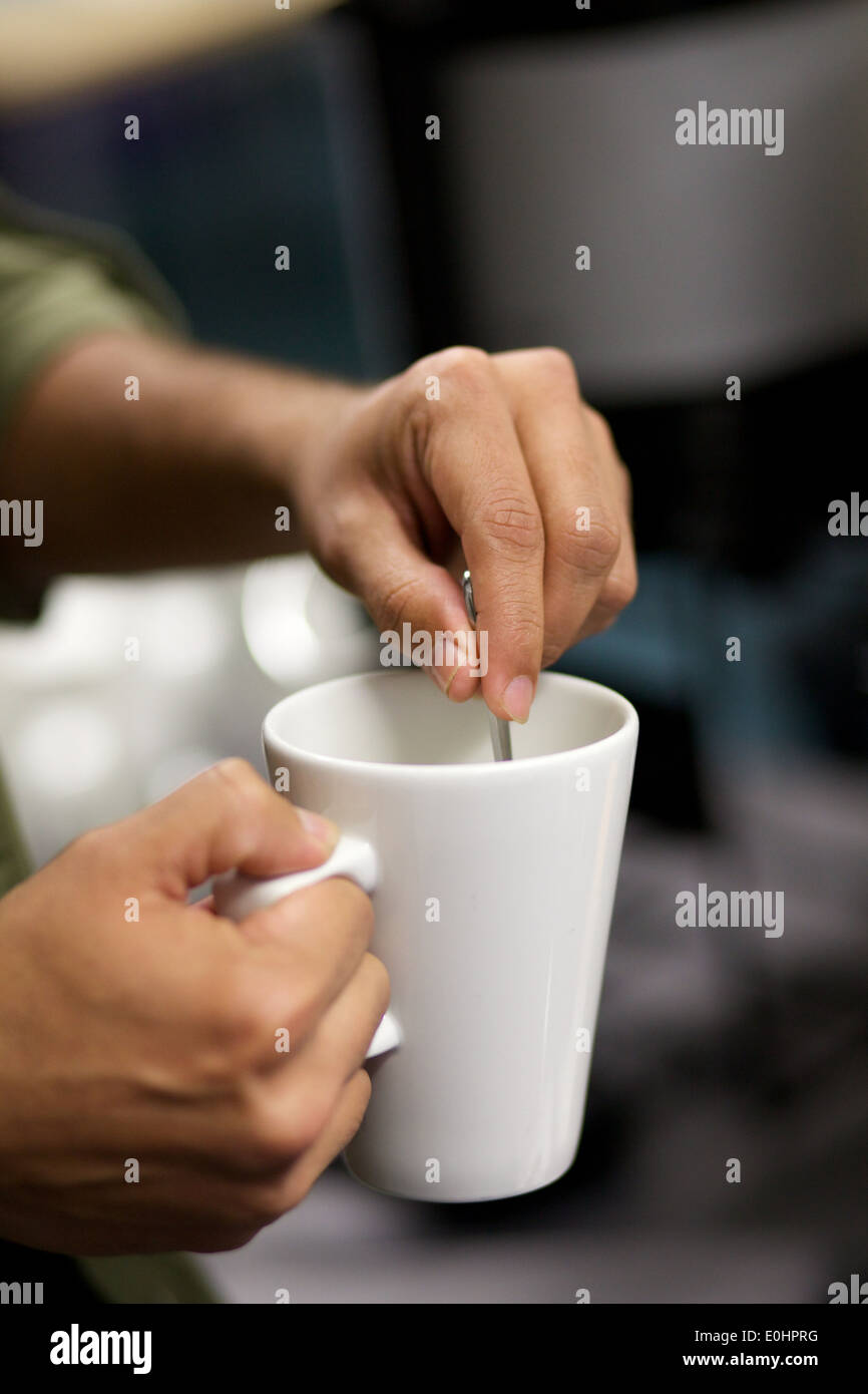close up of hands around coffee cup Stock Photo - Alamy