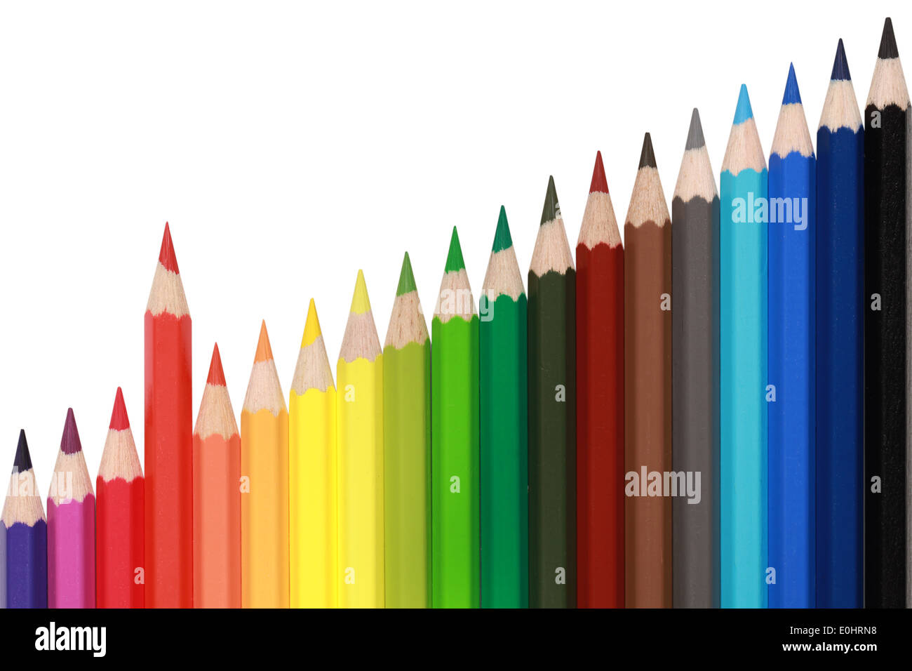 Colored pencils in a row forming a rising chart with a red pencil ...
