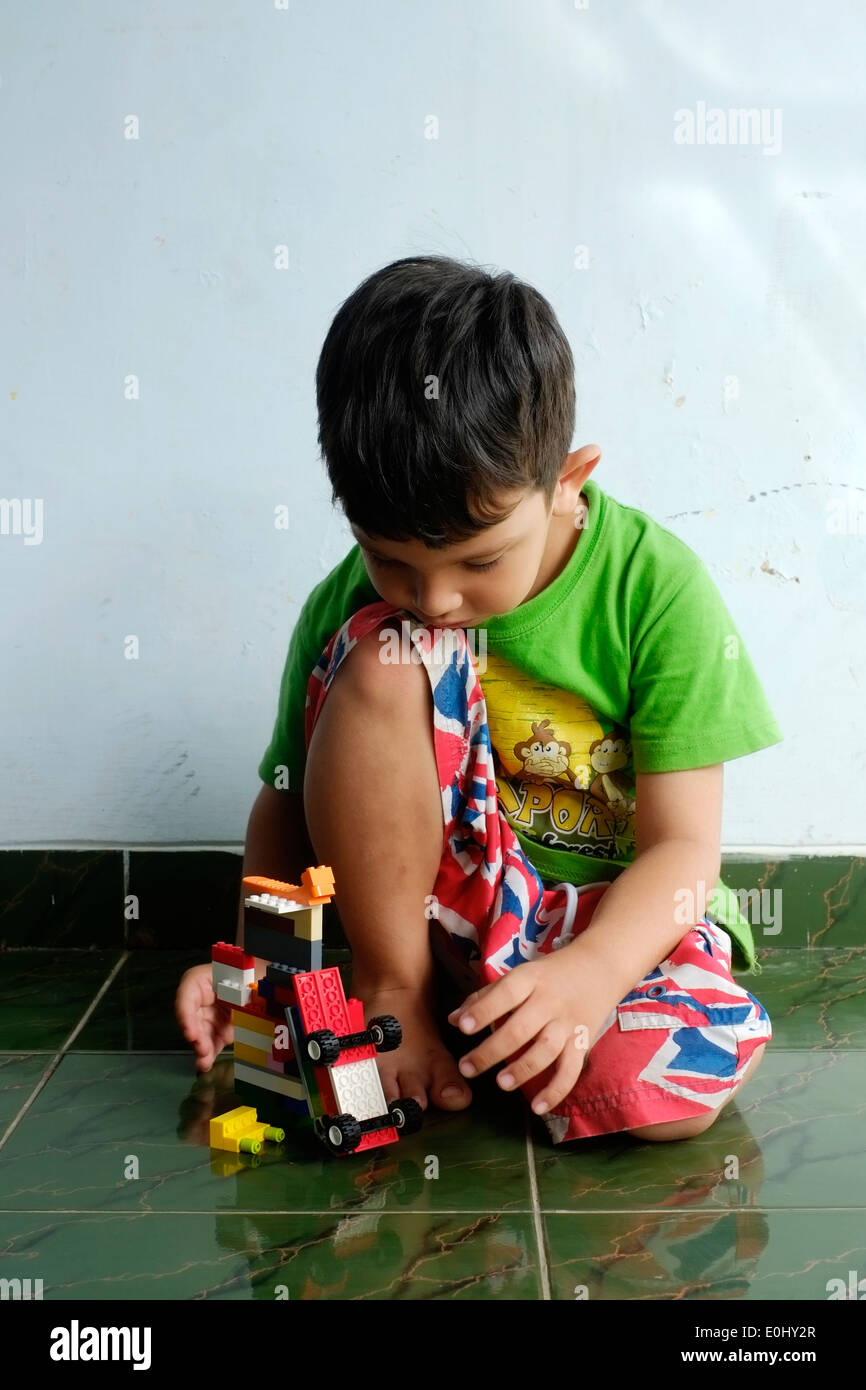 little boy playing with lego Stock Photo - Alamy