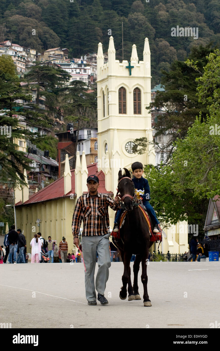 A child enjoys a pony ride Stock Photo - Alamy