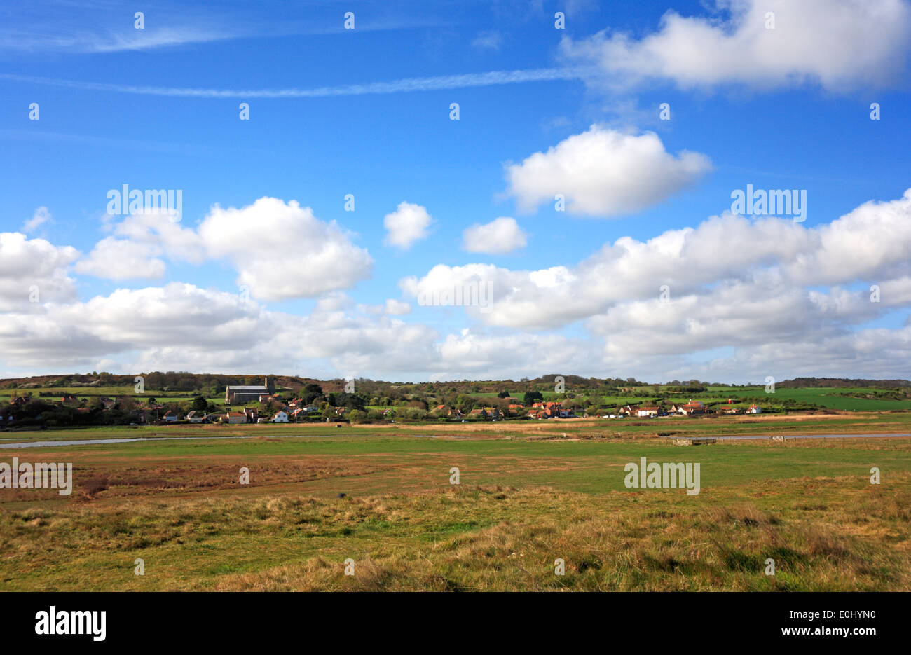 A view of the grazing marshes and the village of Salthouse on the North ...