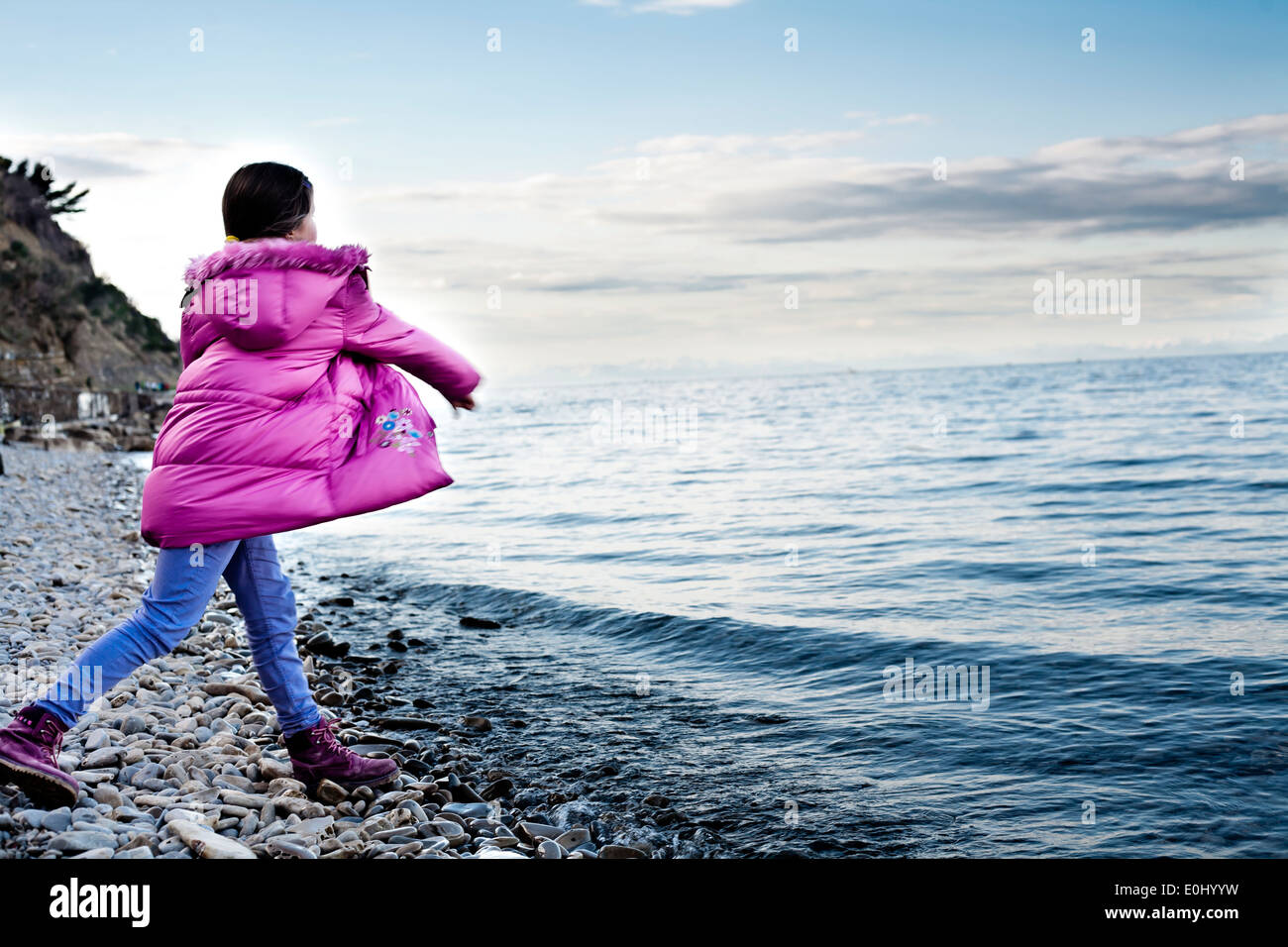Woman throwing stone sea hi-res stock photography and images - Alamy