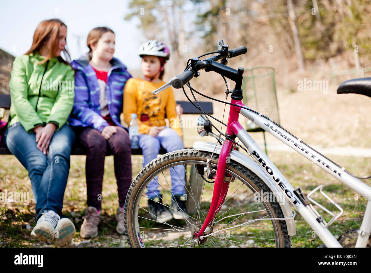 Bikers resting on a bench Stock Photo - Alamy