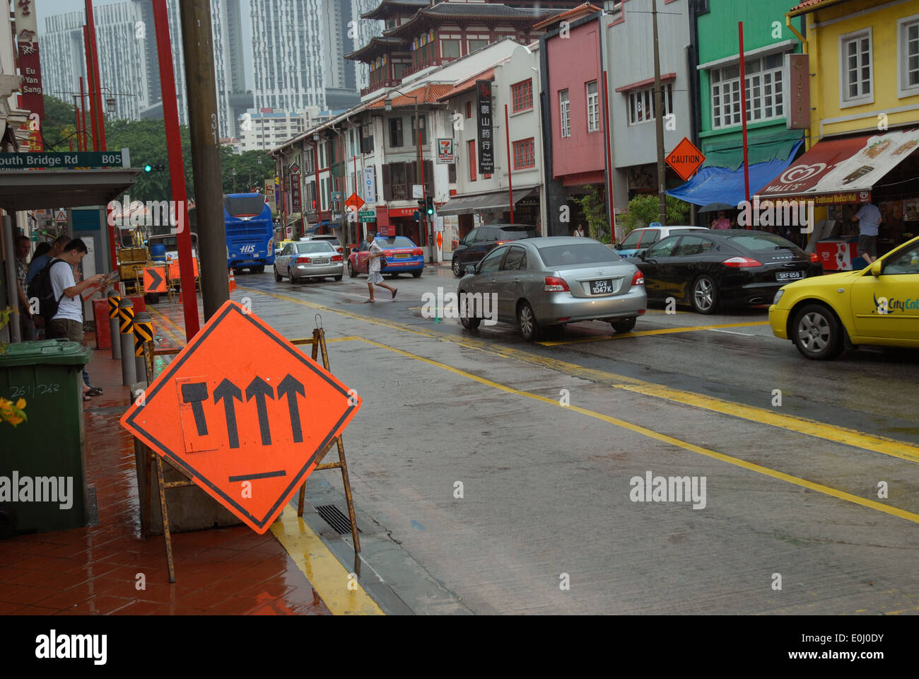Black Arrows on Road Sign, Singapore Stock Photo - Alamy
