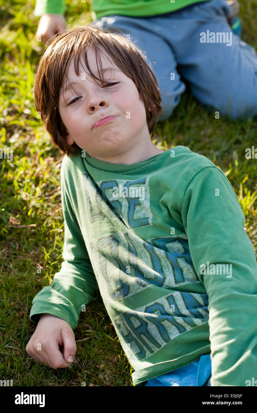 Boy playing outdoors Stock Photo - Alamy