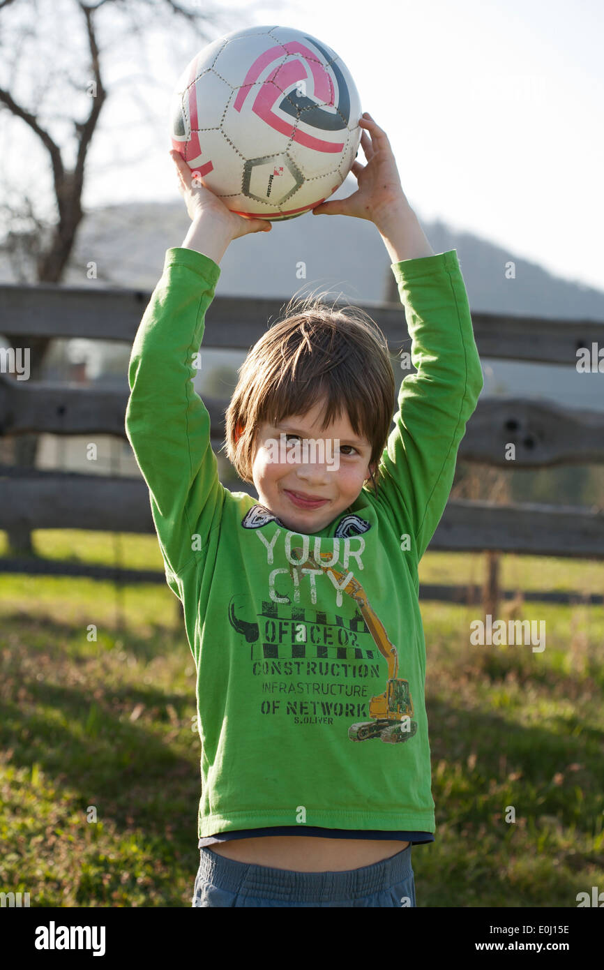Blond boy playing football soccer hi-res stock photography and images ...
