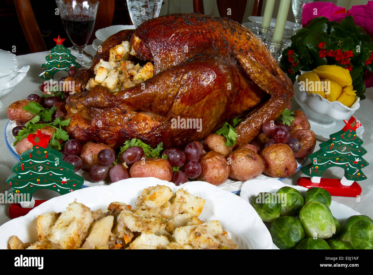 Christmas dinner of turkey with stuffing and vegetables on a dining ...