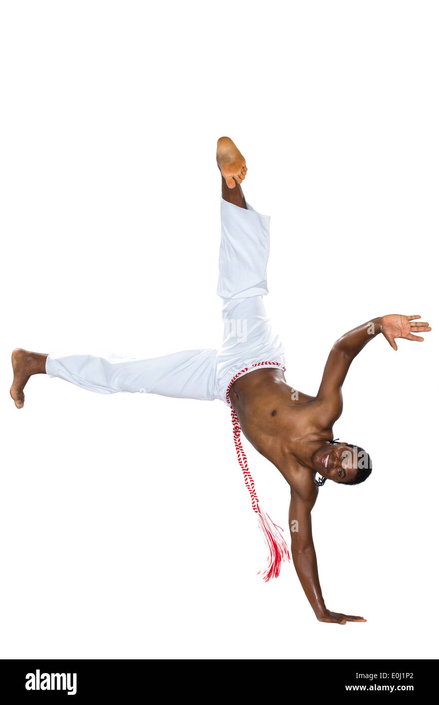 Capoeira, Brazilian Man, white pants. standing on one hand Stock Photo ...