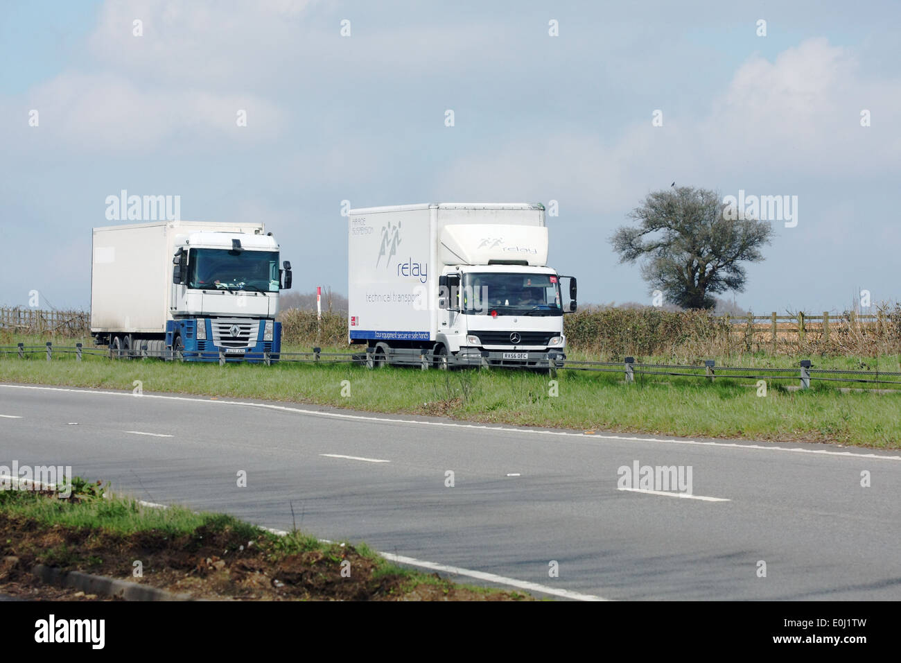 Two heavy trucks hi-res stock photography and images - Alamy