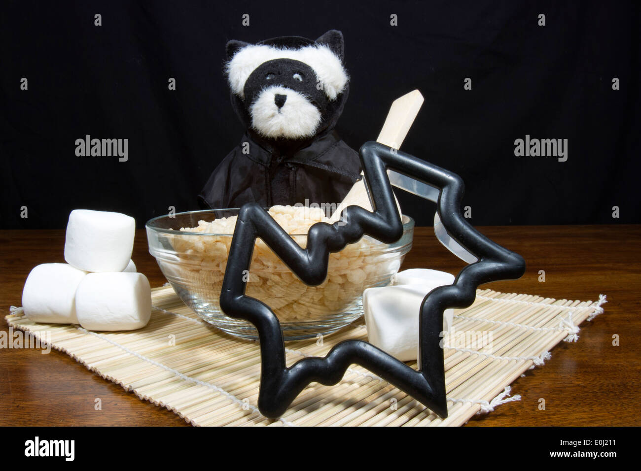 Cute halloween bear dressed as a vampire bat making bat shaped puffed ...