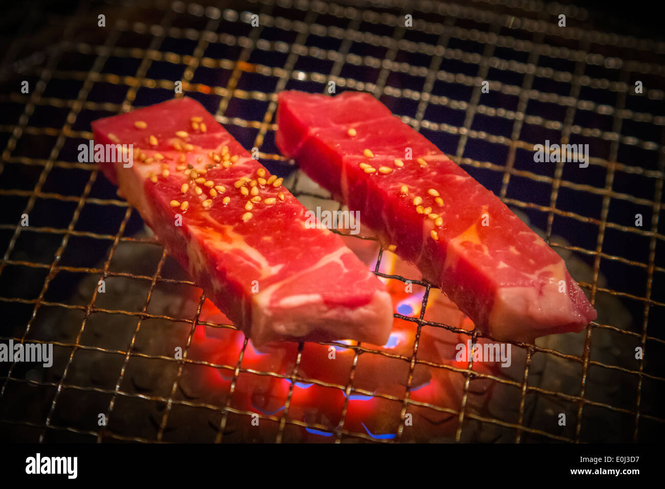 Beef over charcoal grill Stock Photo - Alamy