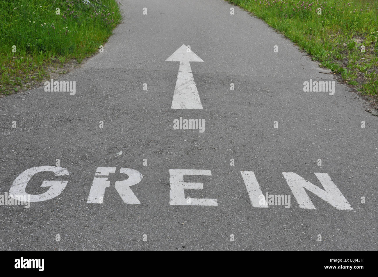 Painted sign and arrow for the Austrian village of Grein, on a bike ...