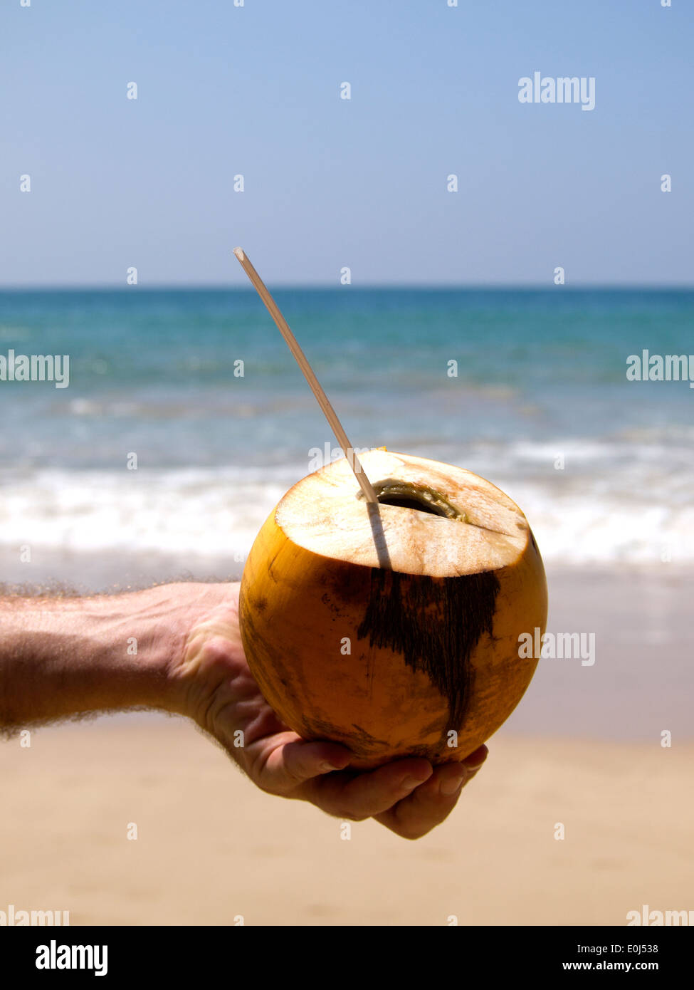Man with coconut hi-res stock photography and images - Alamy