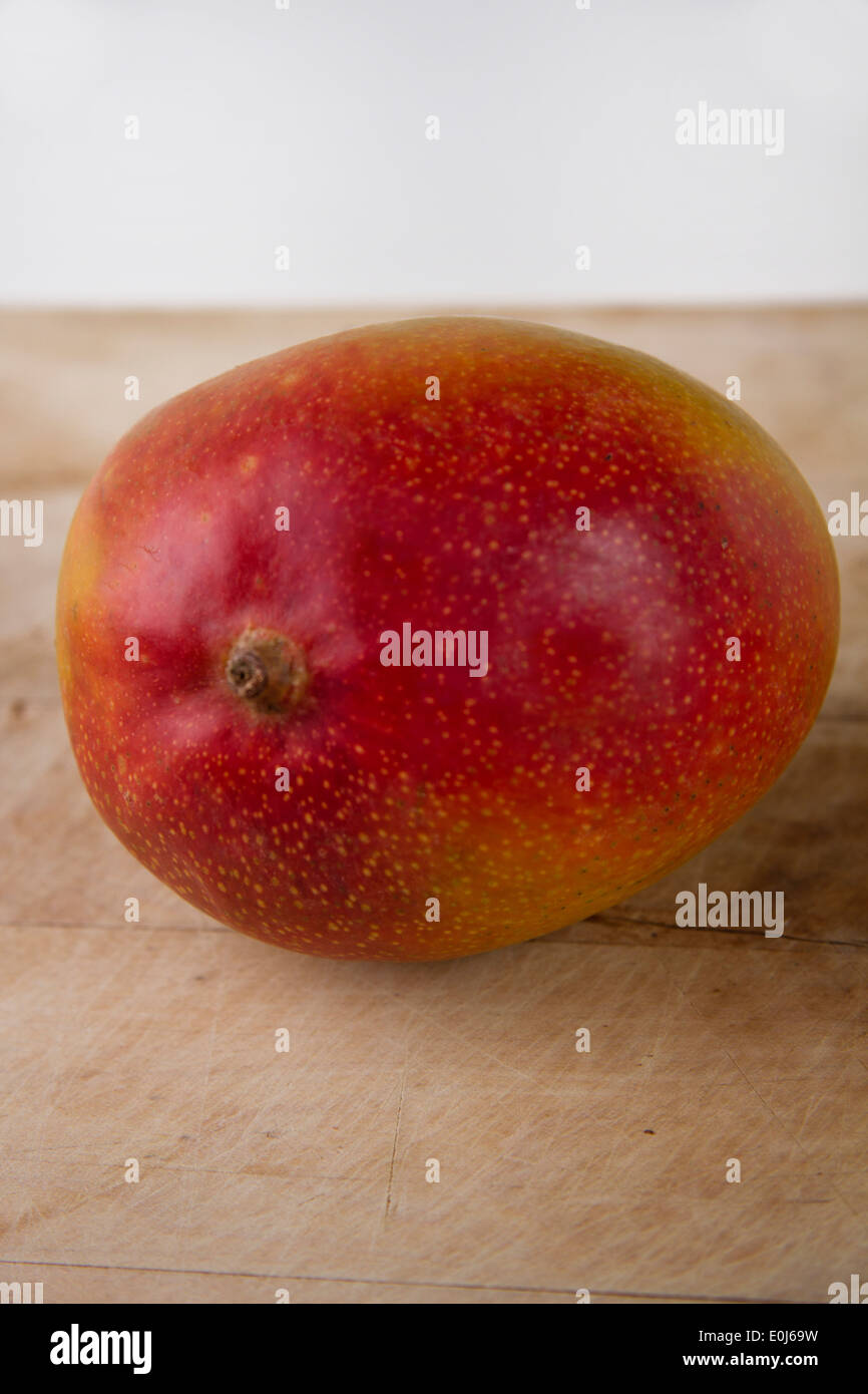 Alfonso mango fruit on a wooden block Stock Photo - Alamy