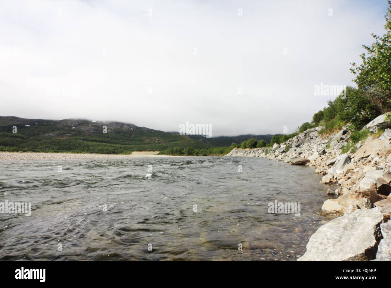 Beautiful river in mountain valley with stone shore Stock Photo - Alamy