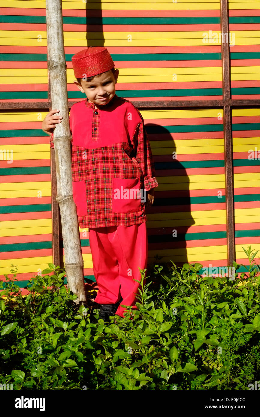 little indonesian schoolboy proudly posing in his school uniform in a ...