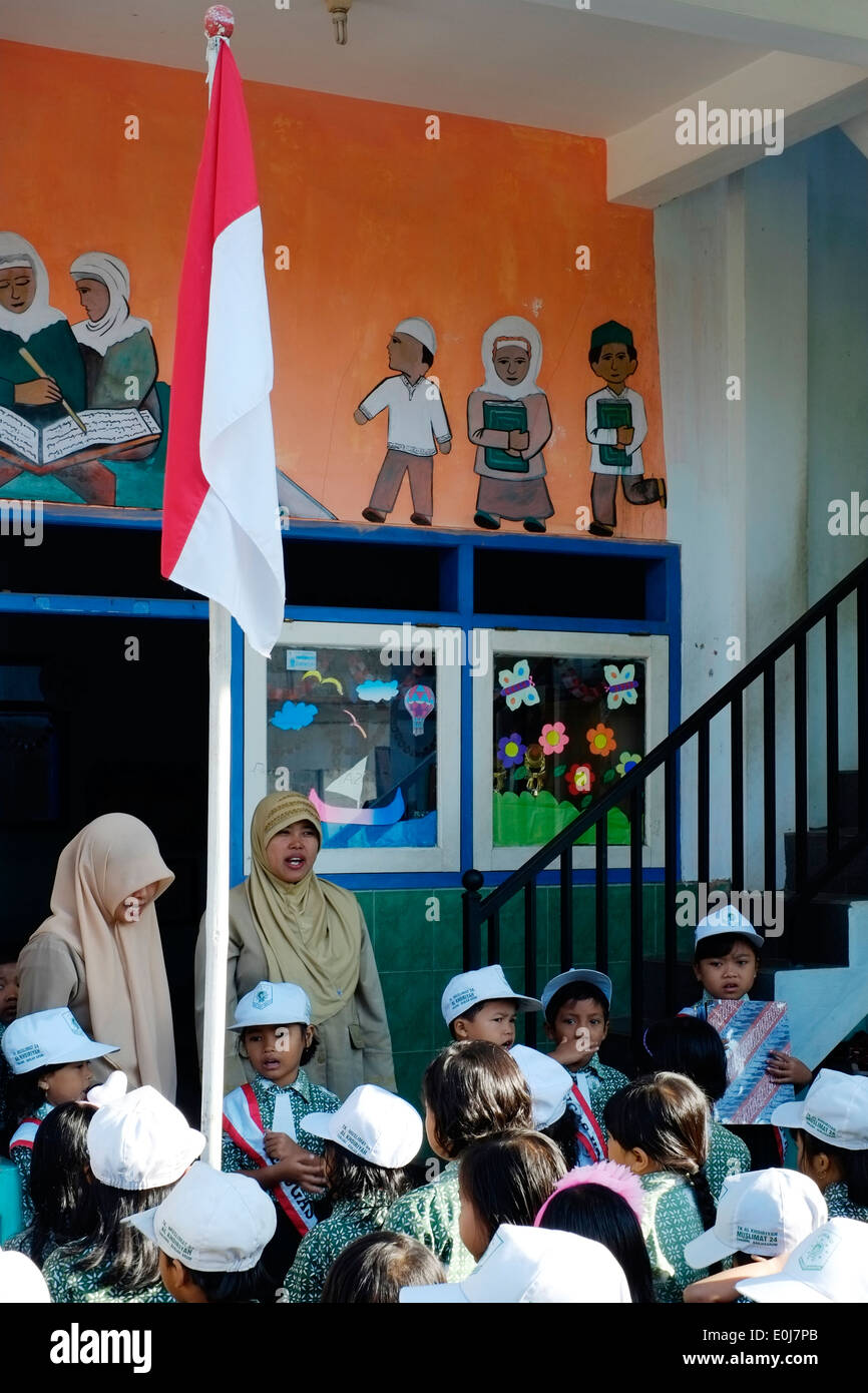 indonesian primary school children and their teachers sing the ...