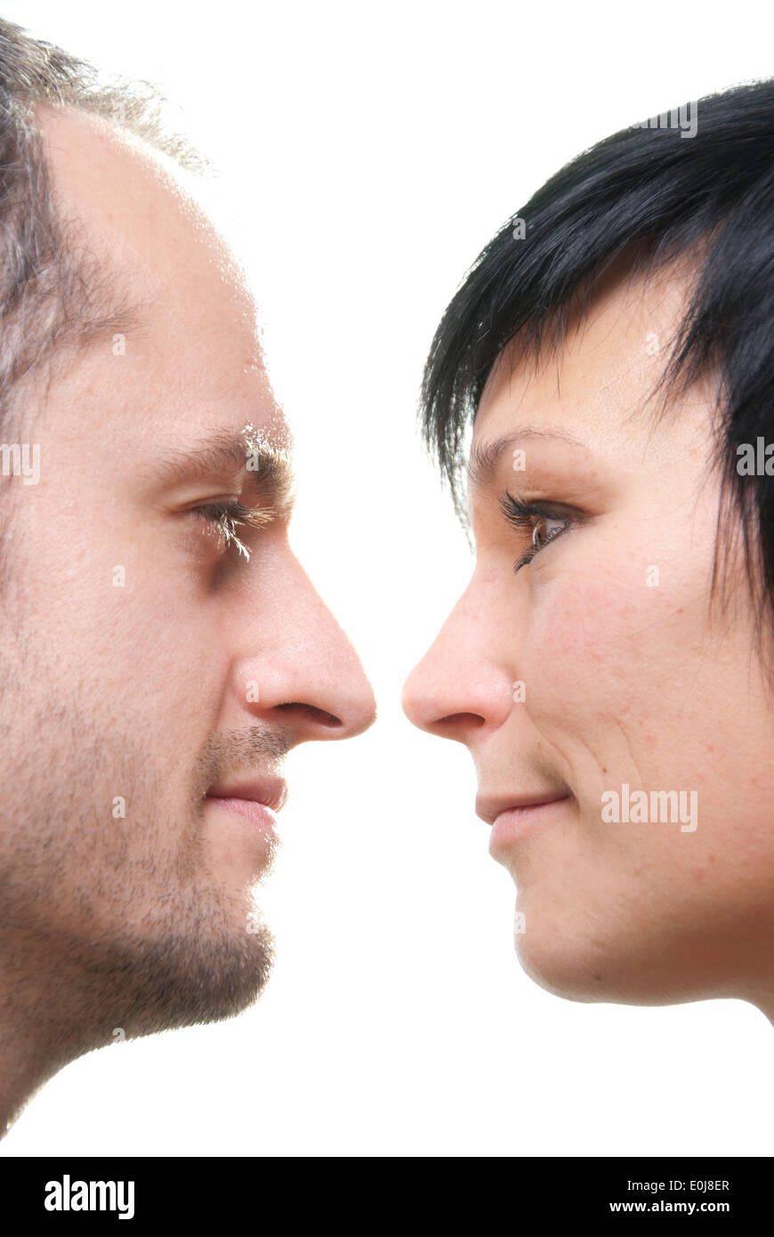 Young couple looks in the eyes of each other Stock Photo - Alamy
