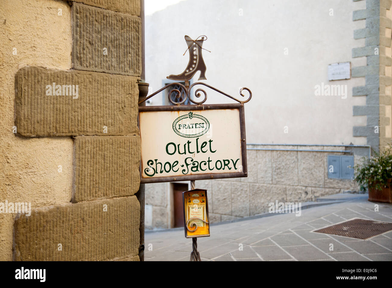 Cute, shoe store sign in Radda Stock Photo - Alamy