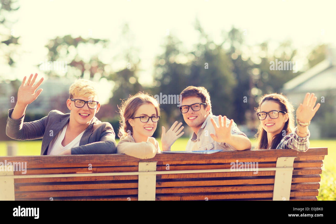 group of students or teenagers waving hands Stock Photo - Alamy