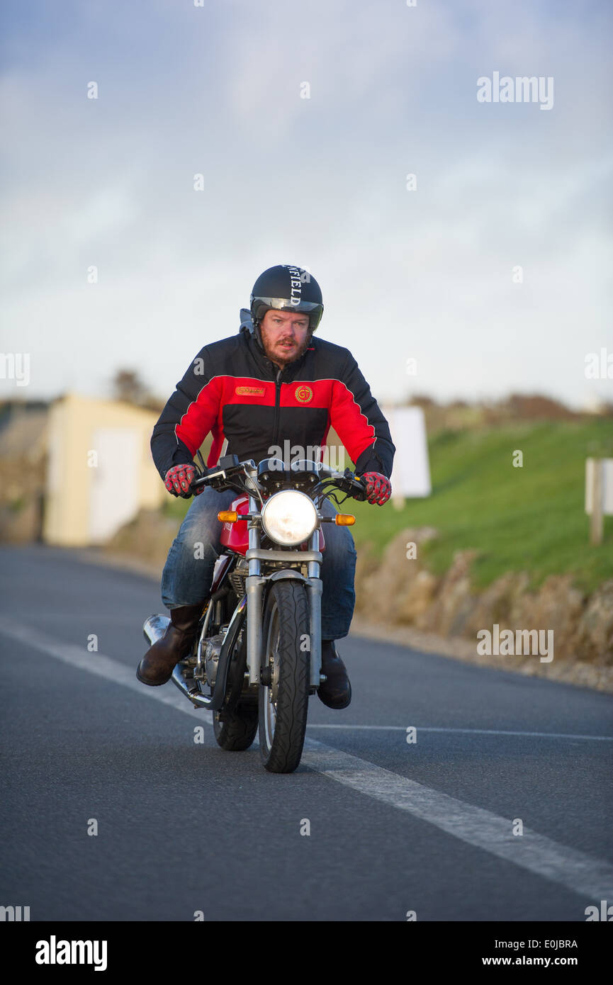 Motorcycle rider Dan Cartwright completes the final leg of a "Top to ...