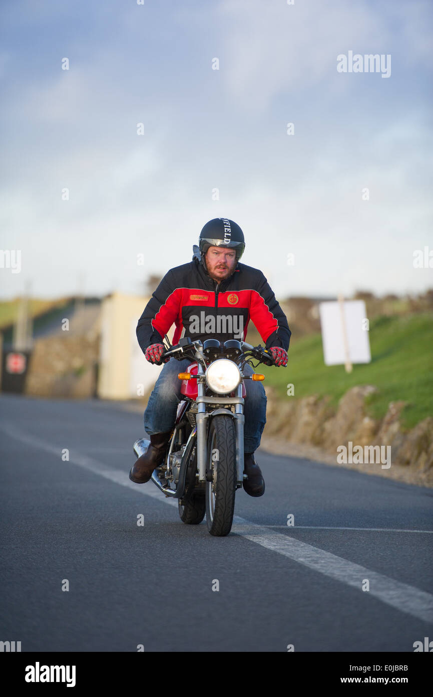 Motorcycle rider Dan Cartwright completes the final leg of a "Top to ...