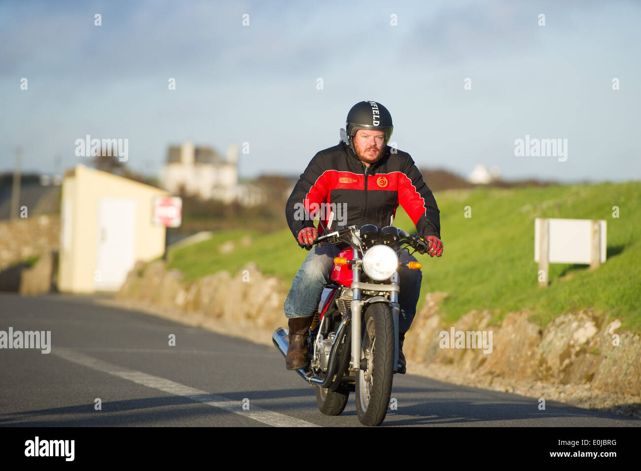 Motorcycle rider Dan Cartwright completes the final leg of a "Top to ...