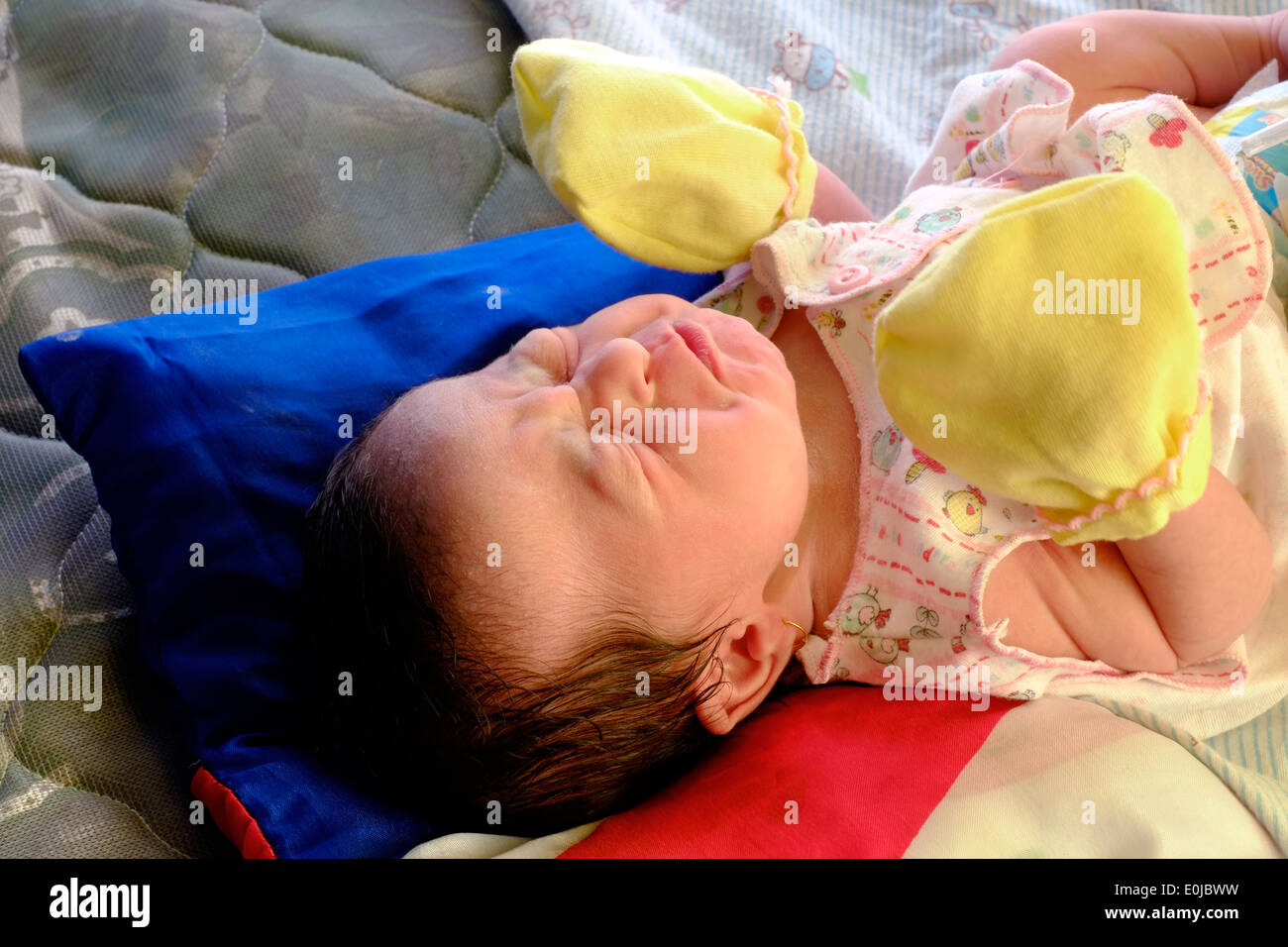 newborn baby girl less than a week old getting her first experience ...