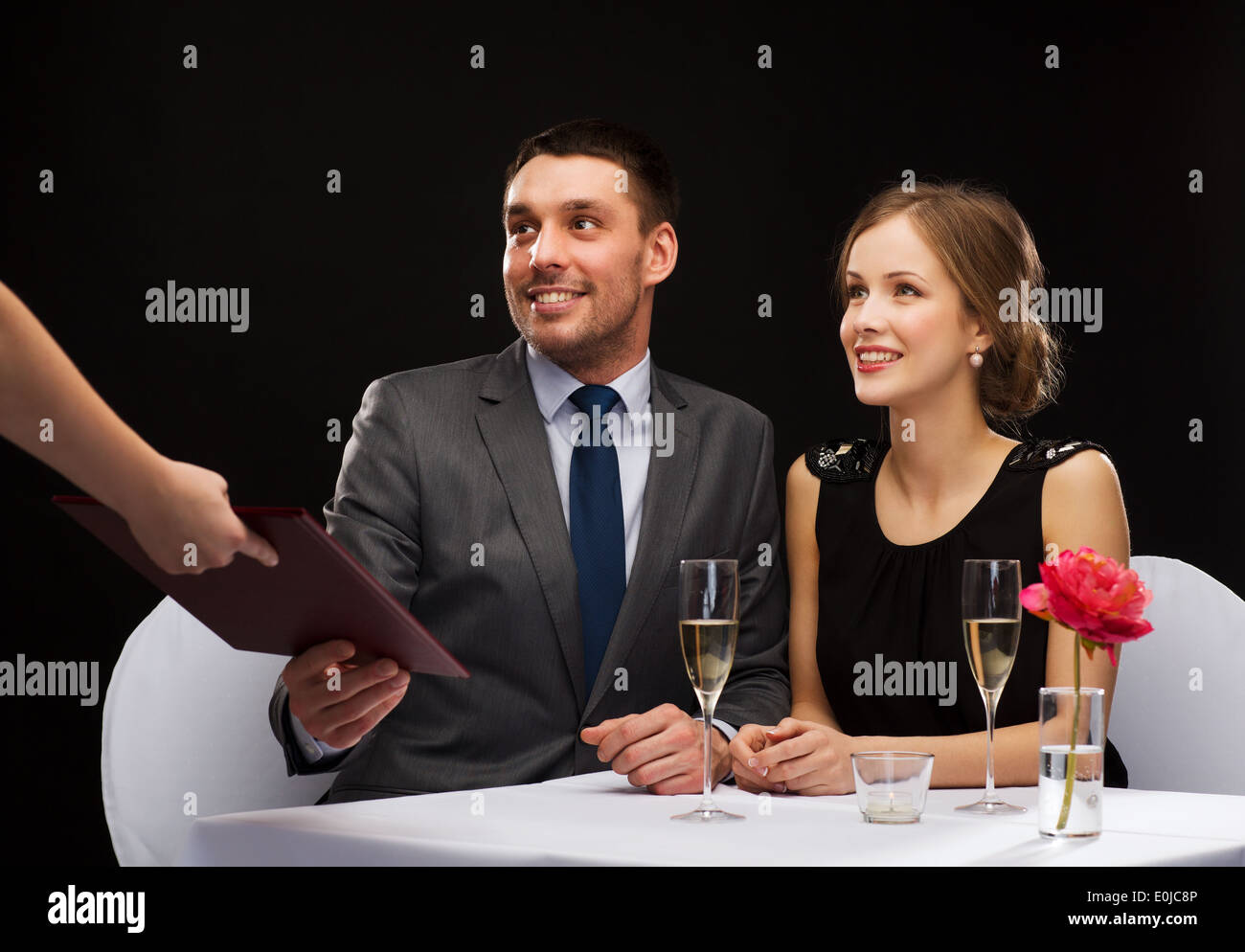 Couple giving order to waiter hi-res stock photography and images - Alamy