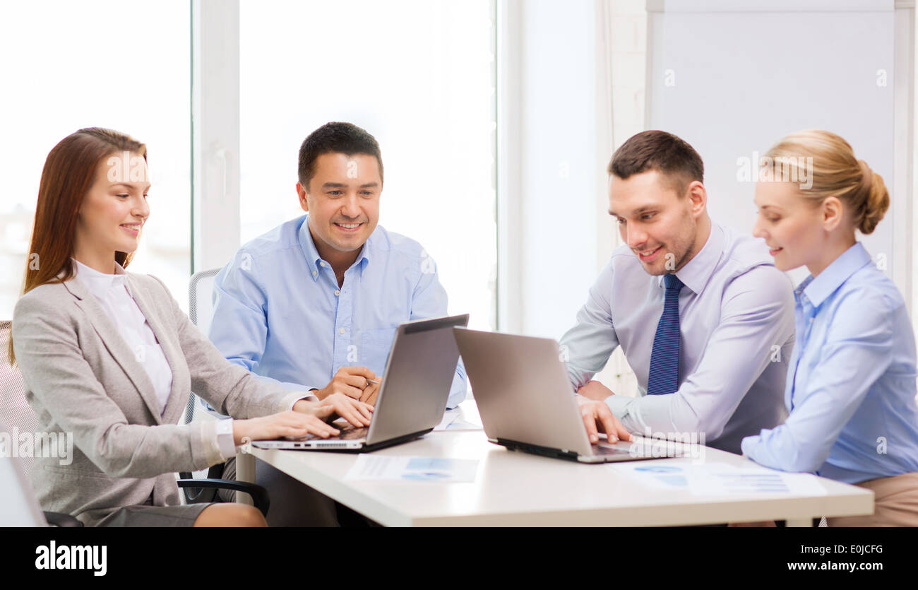 business team working with laptop in office Stock Photo - Alamy