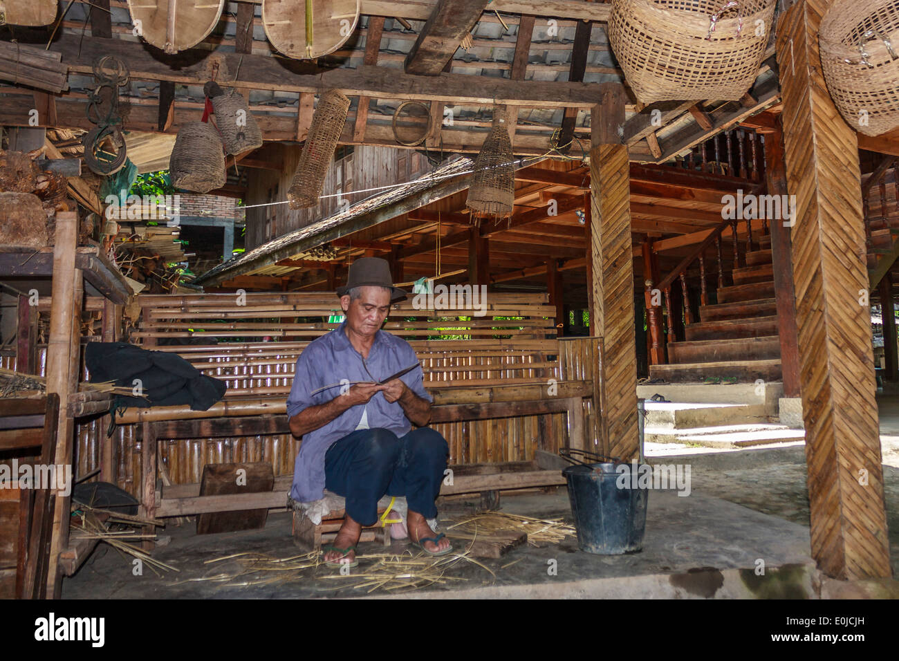 Senior man creating wooden crafts Stock Photo - Alamy